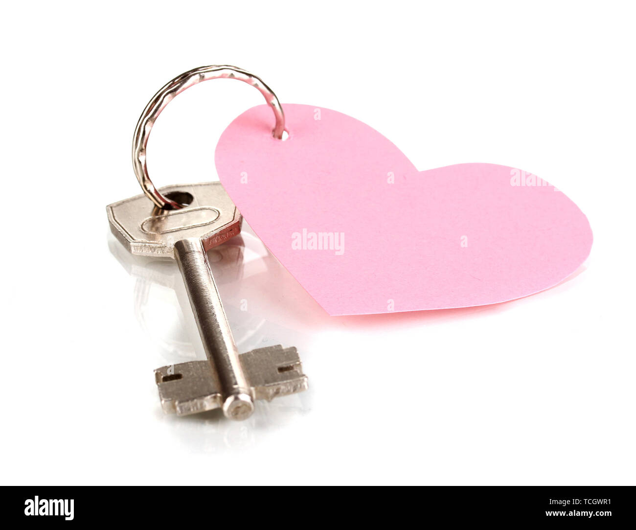 Key with heart-shaped charm isolated on white Stock Photo - Alamy