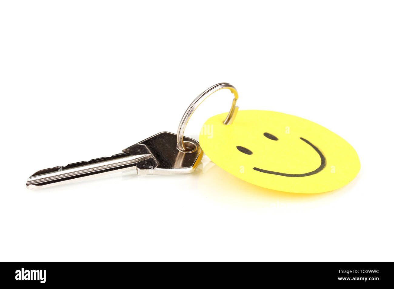 Key with smile-charm isolated on white Stock Photo - Alamy