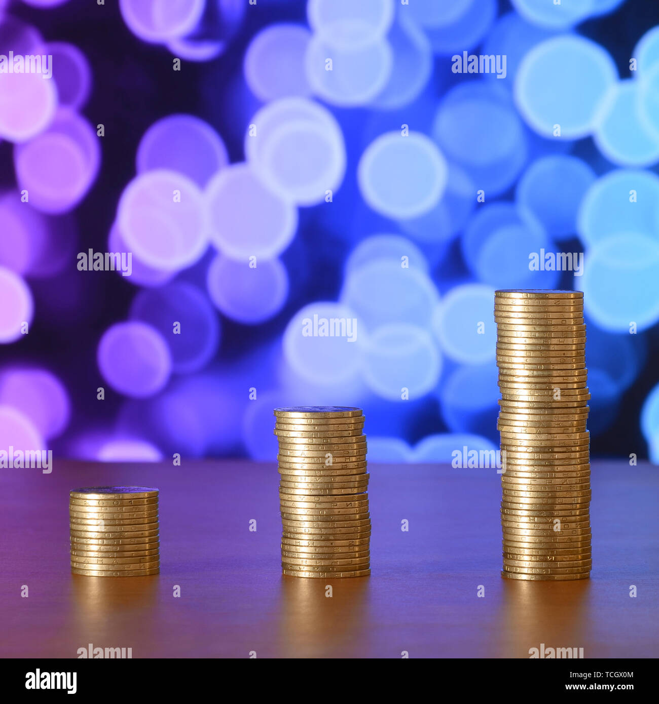 Golden coin stacks arranged as a graph. Increasing columns of coins ...