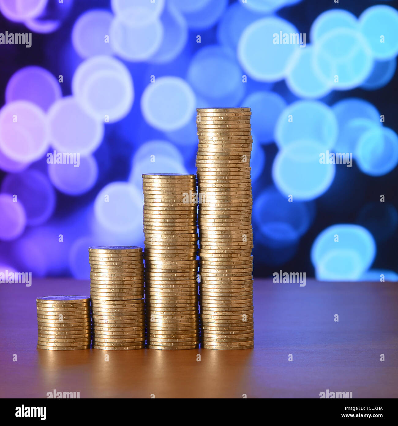 Golden coin stacks arranged as a graph. Increasing columns of coins ...