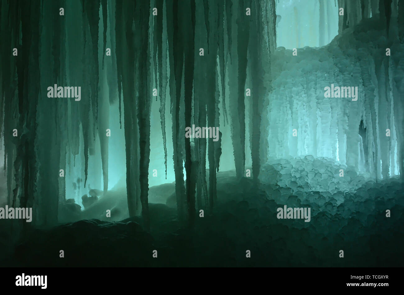 Huge ice icicles. Fragment of large blocks of ice frozen waterfall of ...