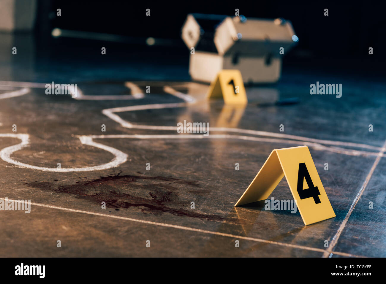 chalk outline, blood stain, investigation kit and evidence markers at ...