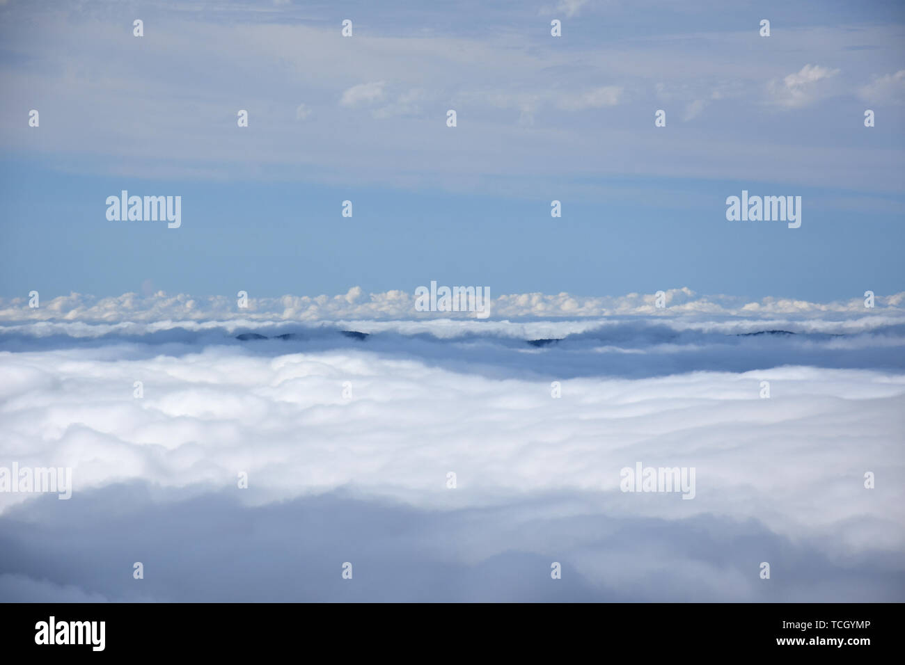 Heavenly landscape with shining sun. Big white clouds on blue sky ...