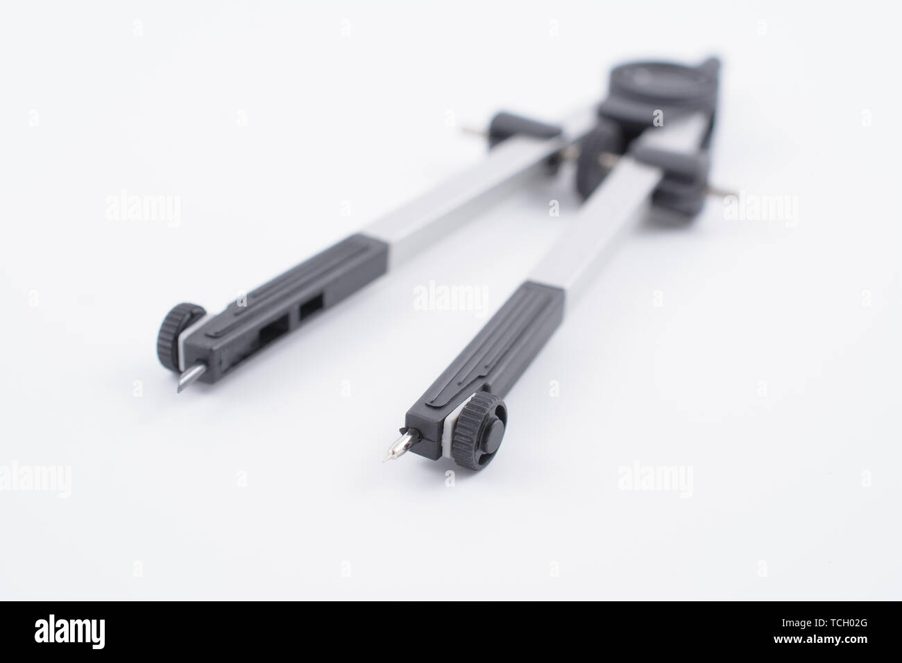 Metal and plastic drafting compass on a white background Stock Photo ...