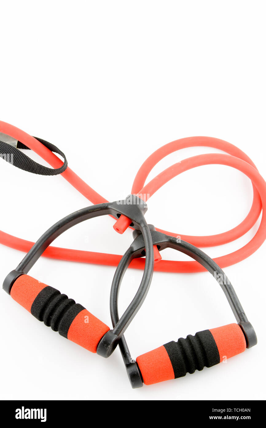 Red resistance bands with red black plastic handles Stock Photo - Alamy