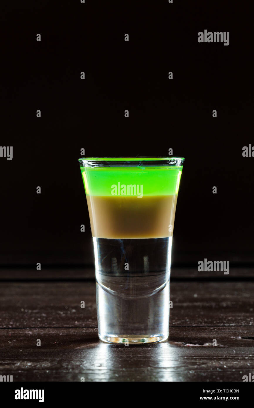 Colorful alcoholic cocktail in a shot glass Stock Photo - Alamy