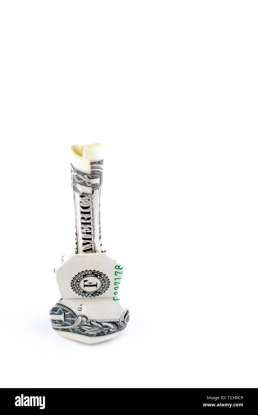 An origami folding of a guitar musical instrument made from a U.S ...