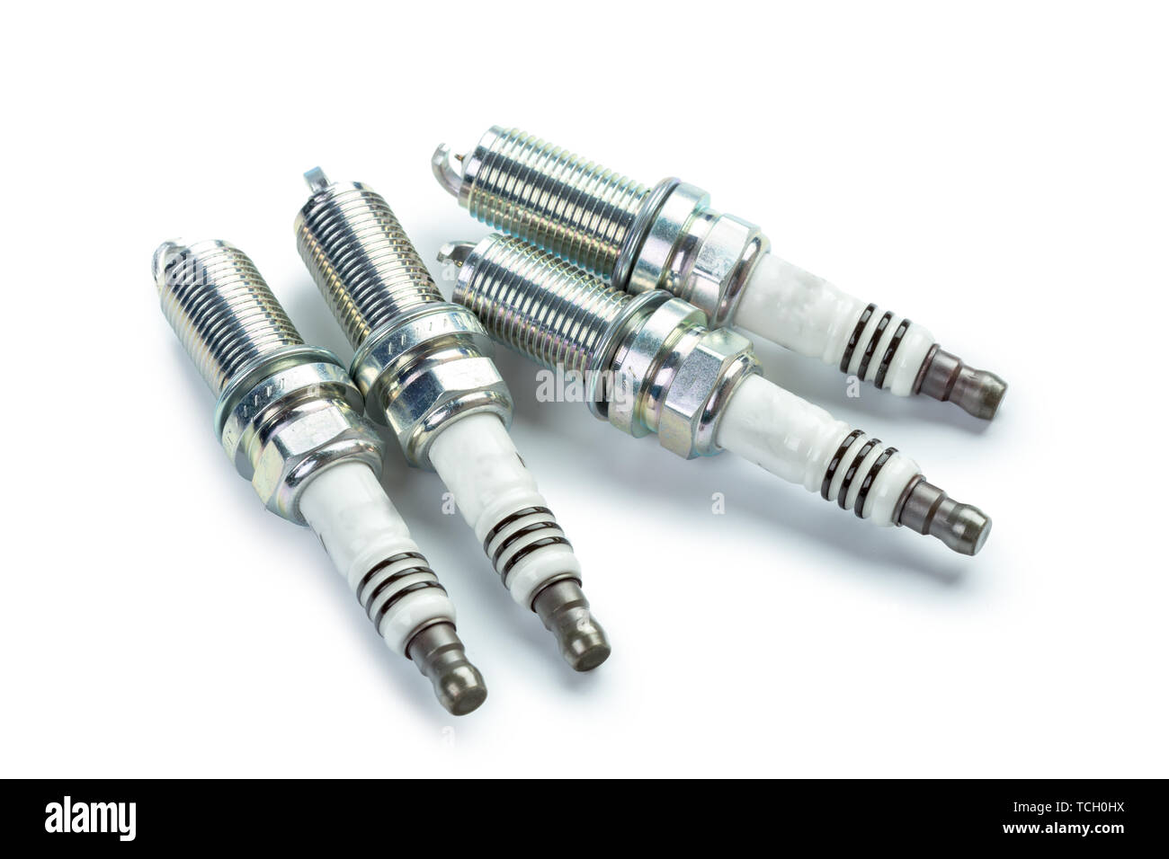 spark plugs isolated on white Stock Photo - Alamy