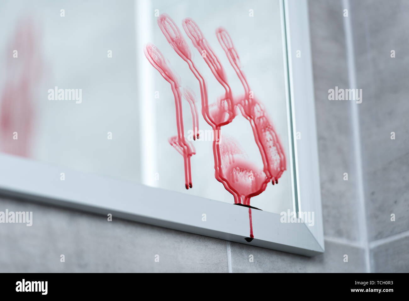 selective focus of bloody handprint on mirror in bathroom Stock Photo ...