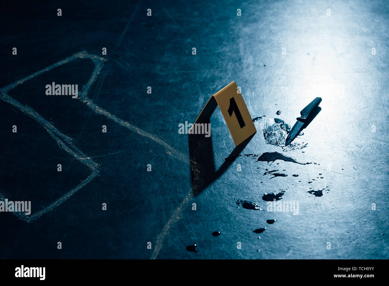 chalk outline, knife and evidence marker at crime scene Stock Photo - Alamy