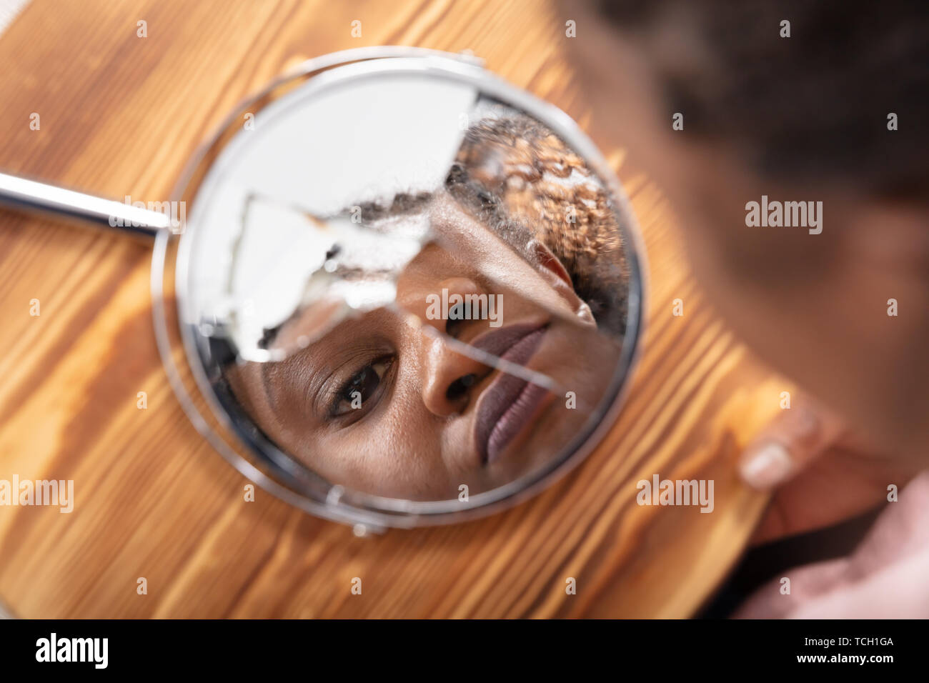 Person looking in a broken mirror hi-res stock photography and images ...