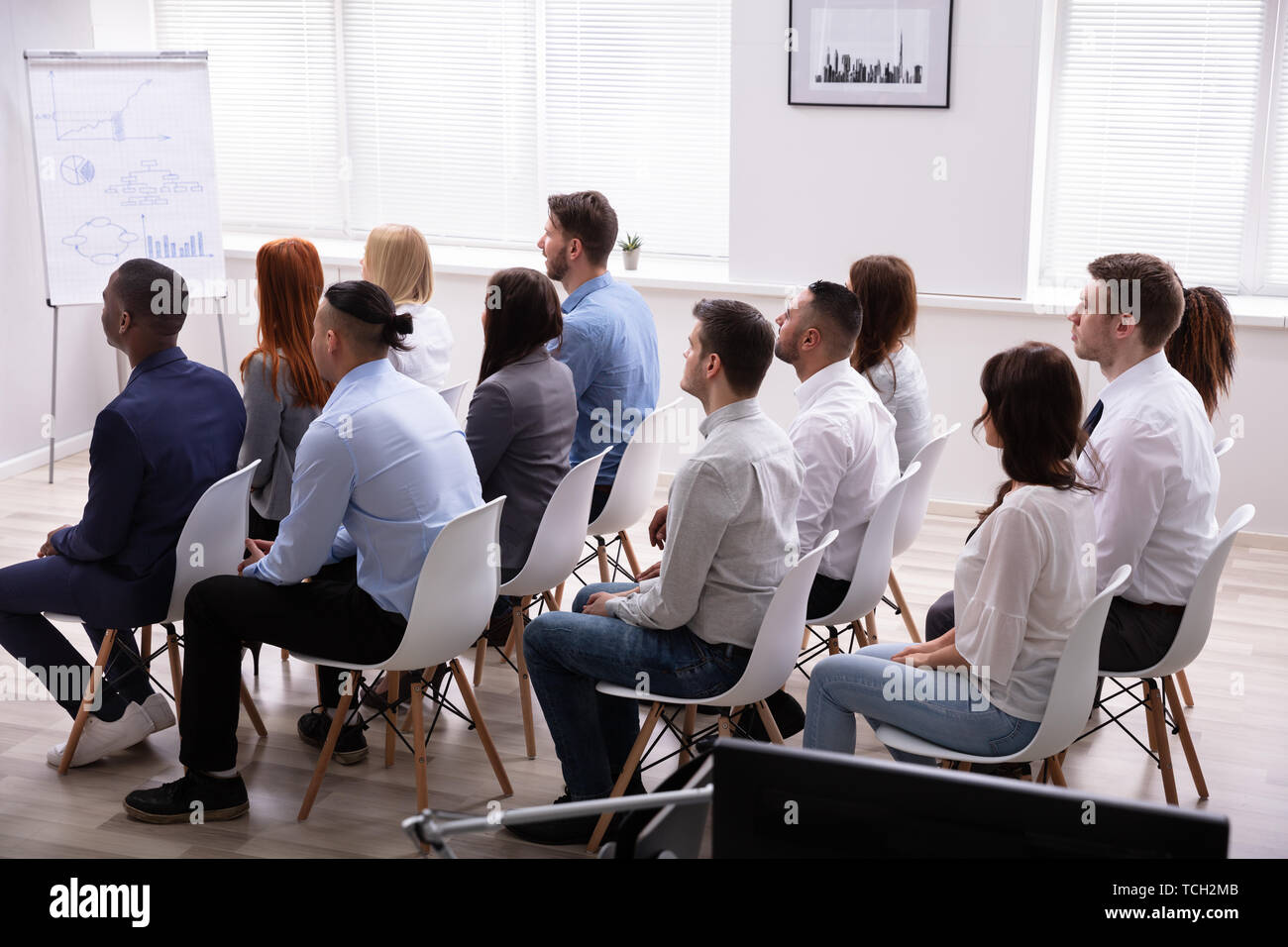 Diverse Group Of Successful Business People Sitting On Chair In The ...