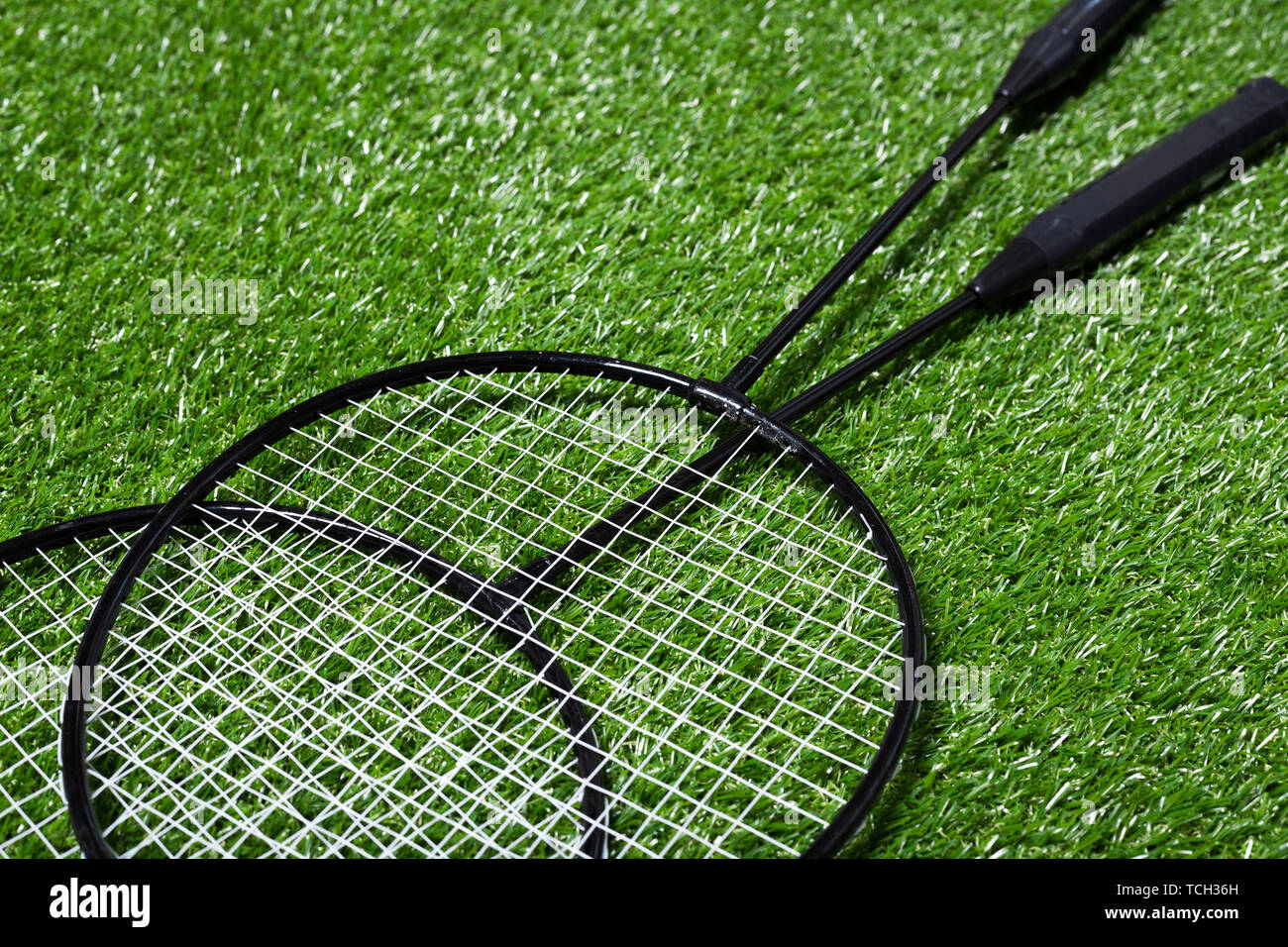 badminton racket on grass Stock Photo - Alamy