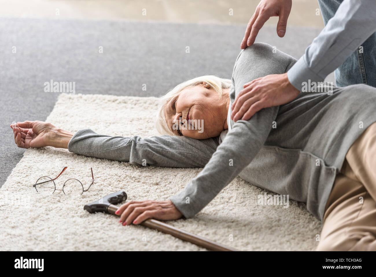 Woman helping fallen hi-res stock photography and images - Alamy