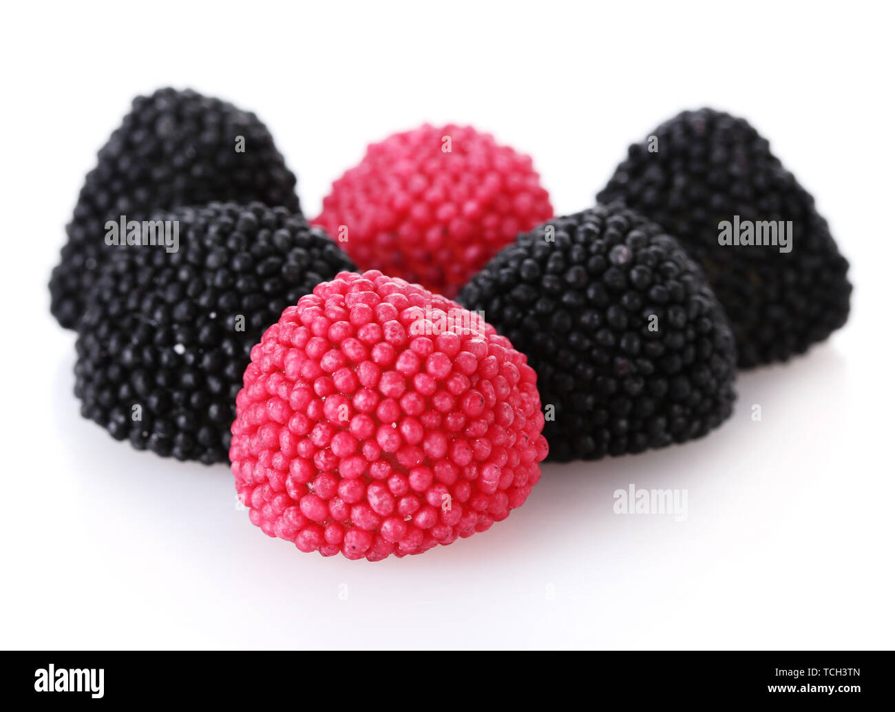 red and black candy berries isolated on white Stock Photo - Alamy