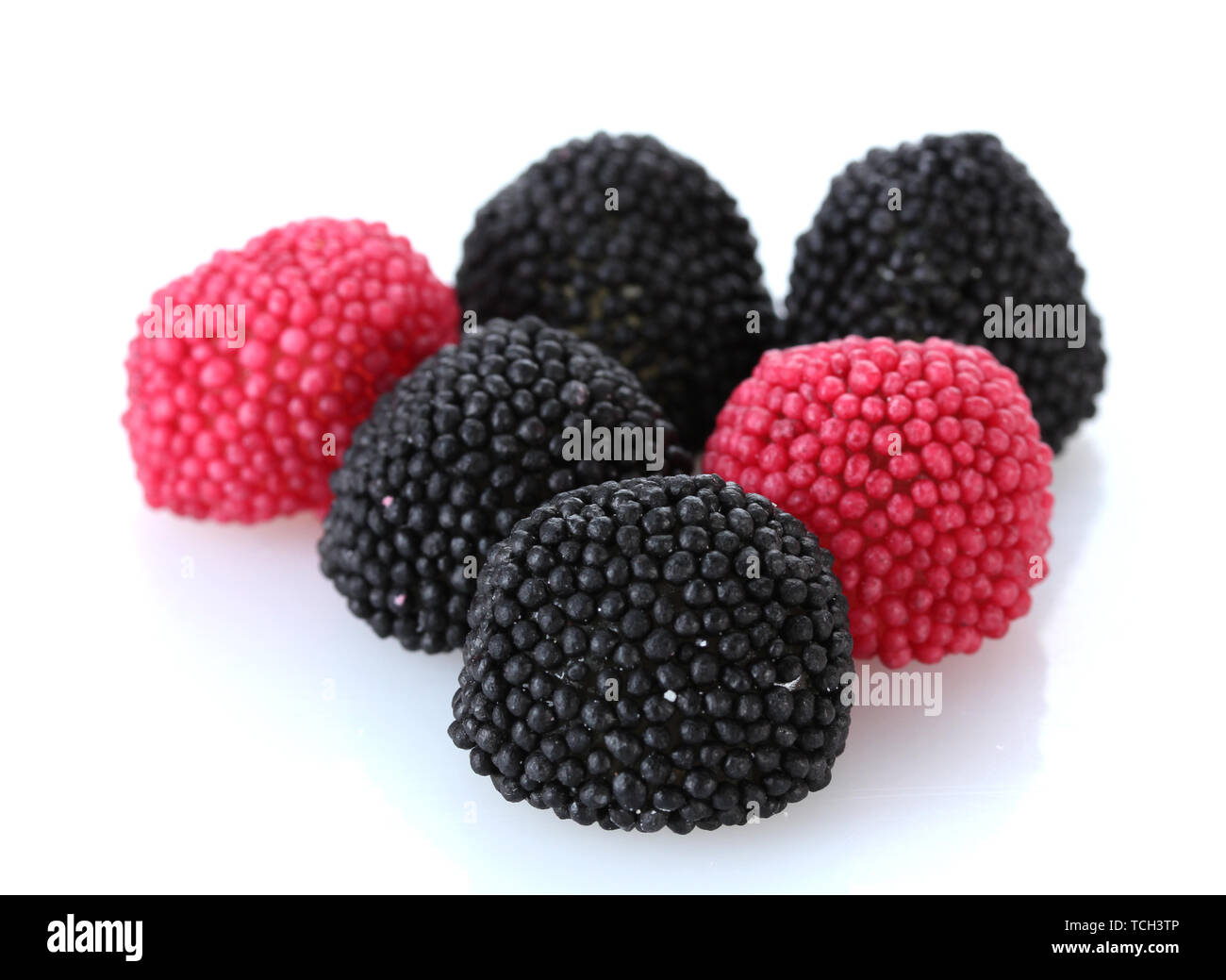 red and black candy berries isolated on white Stock Photo - Alamy