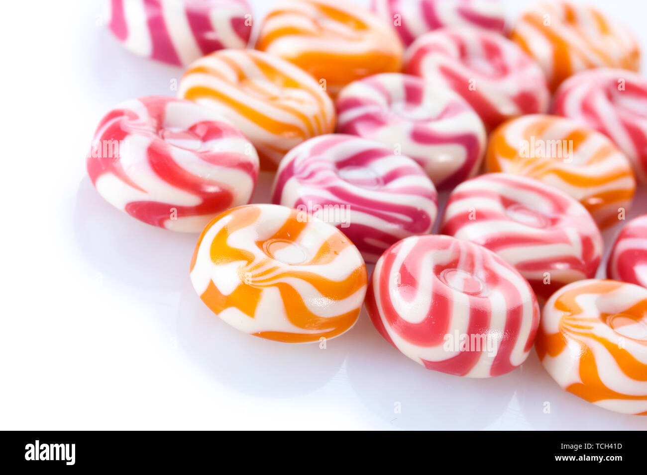 striped fruit candies isolated on white Stock Photo - Alamy
