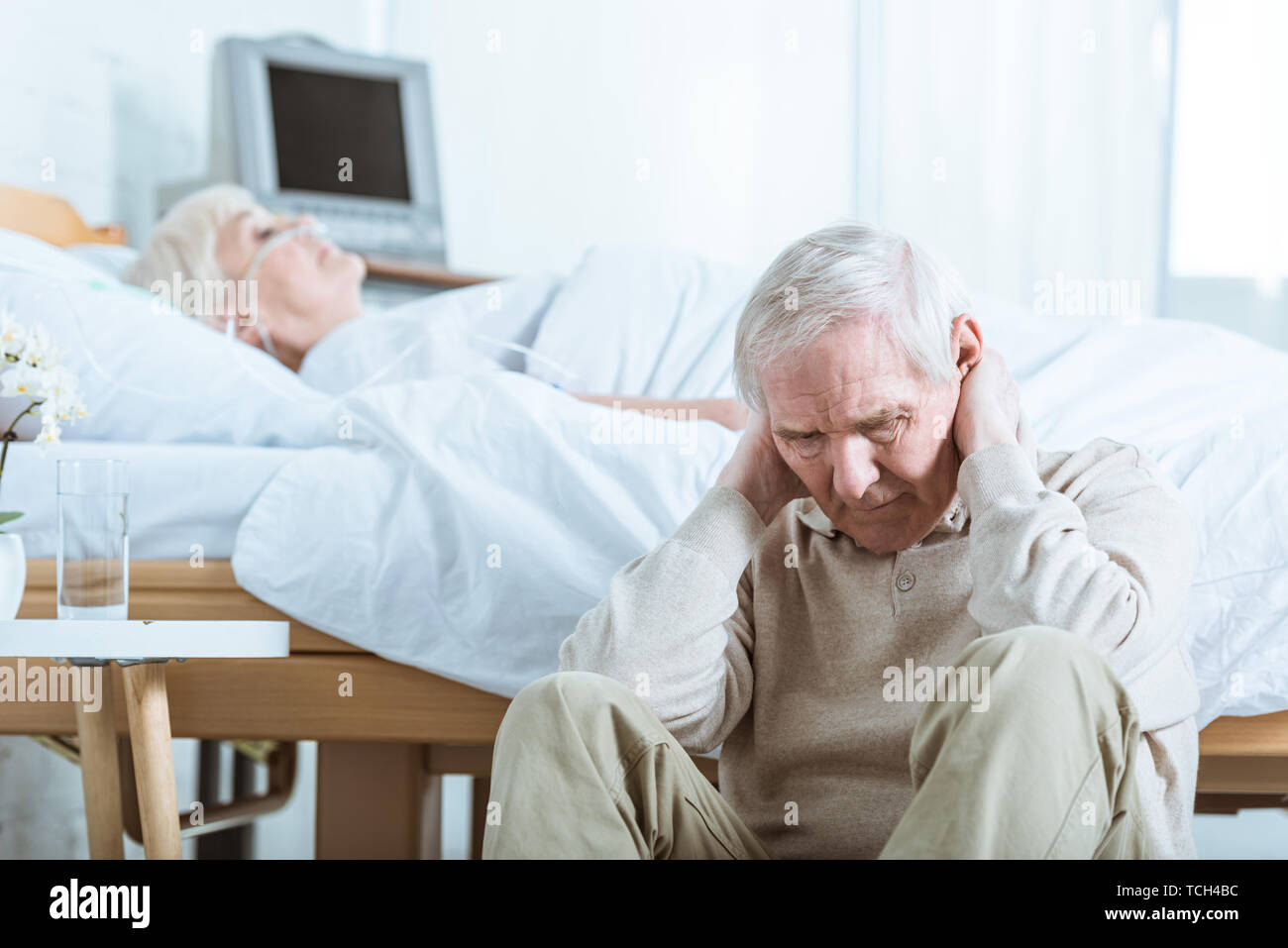 sad senior man and senior woman in coma in hospital Stock Photo - Alamy
