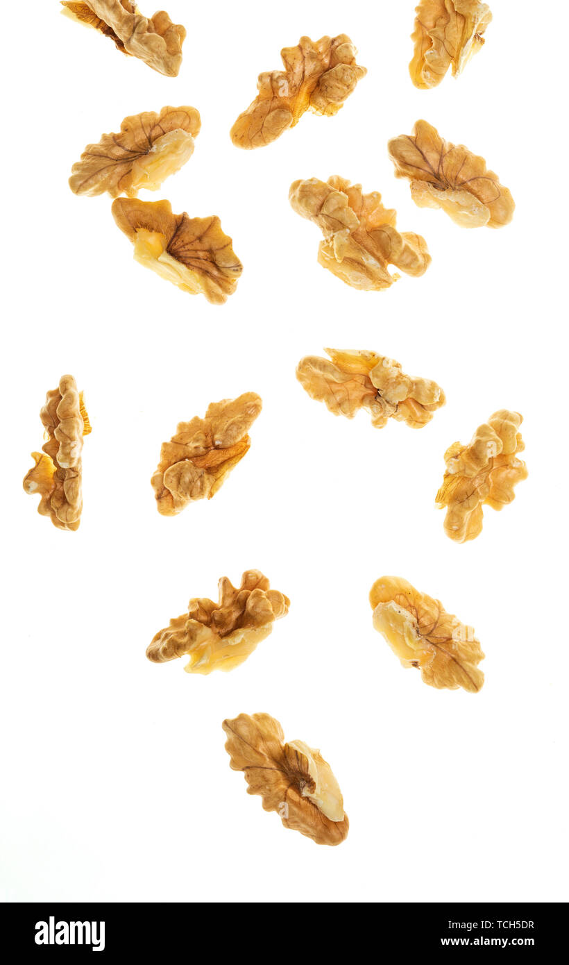 Peeled (open) nuts falling. Isolated on white background Stock Photo ...