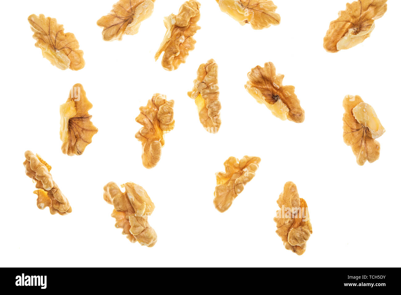 Peeled (open) nuts falling. Isolated on white background Stock Photo ...