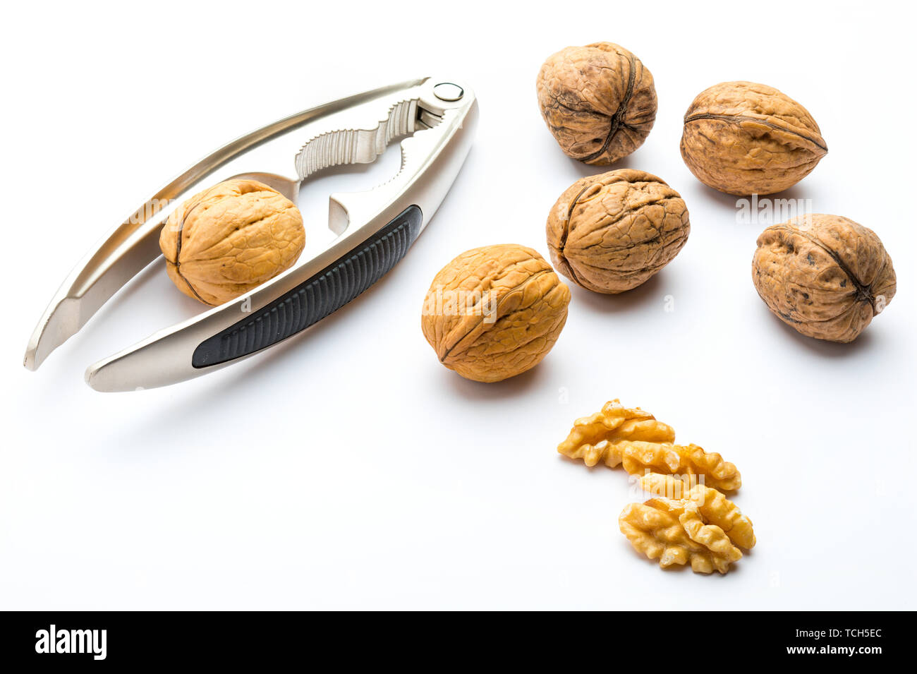 Nuts (whole and open) with cascador. Isolated on white background Stock ...