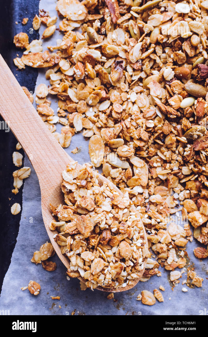 Homemade roasted granola on baking sheet with sesame, pumpkin ...
