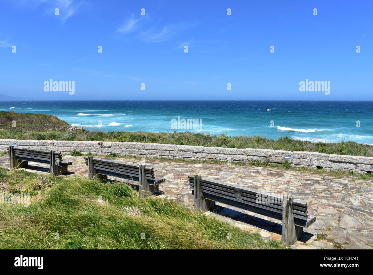 Beach promenade with wooden benches and viewpoint. Lugo, Spain Stock ...