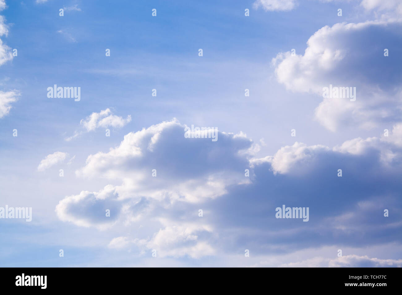 White clouds high in the sky at windy winter day background Stock Photo ...