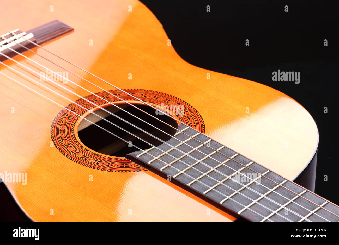 retro guitar on black background Stock Photo - Alamy