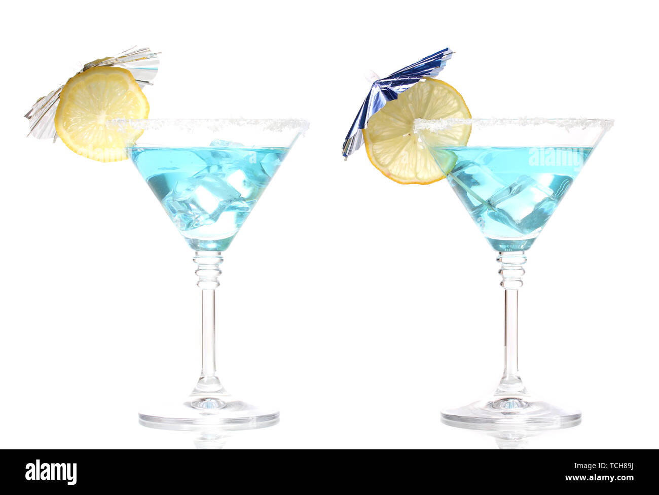 Blue cocktail in martini glasses isolated on white Stock Photo - Alamy