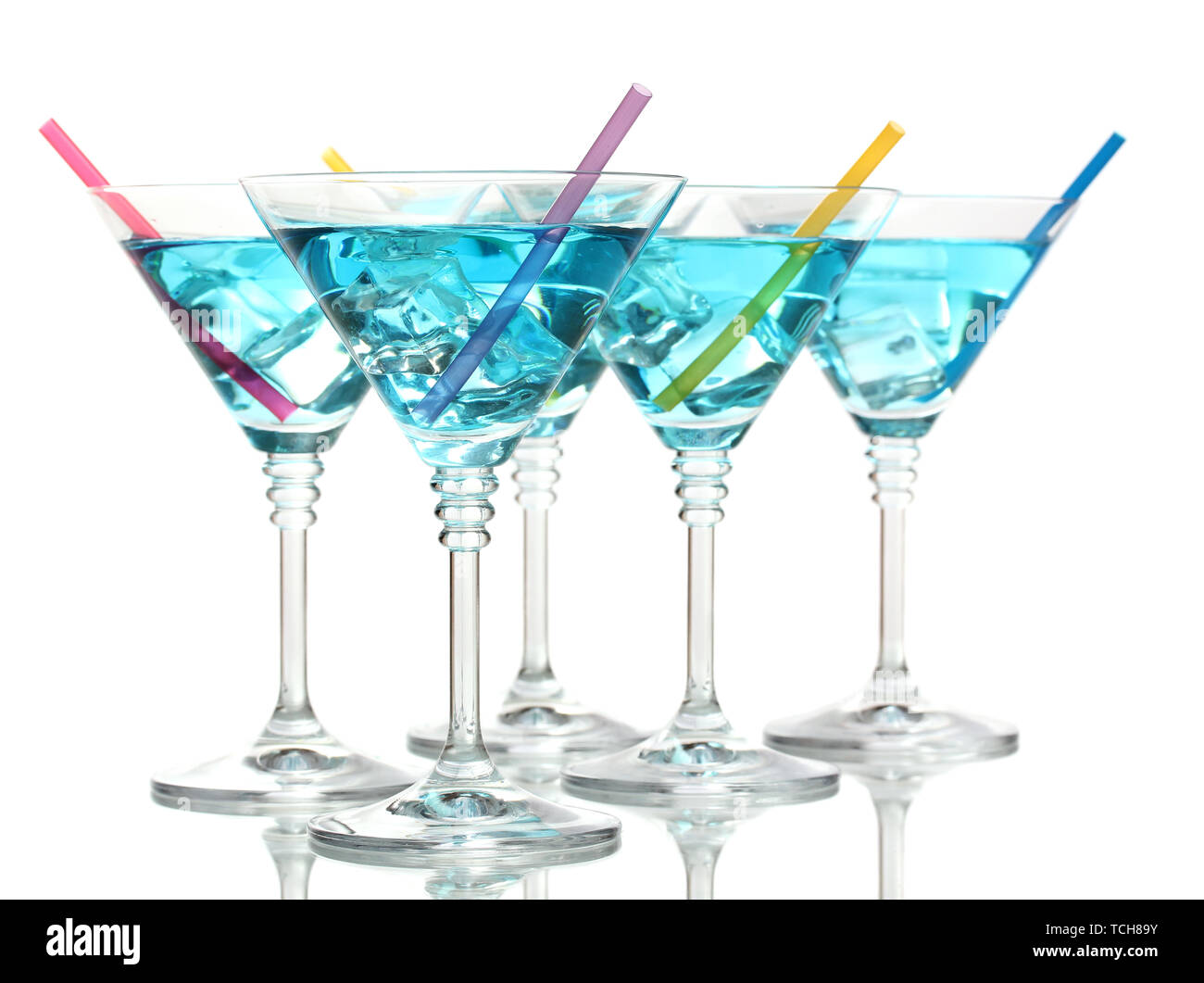 Blue cocktail in martini glasses isolated on white Stock Photo - Alamy