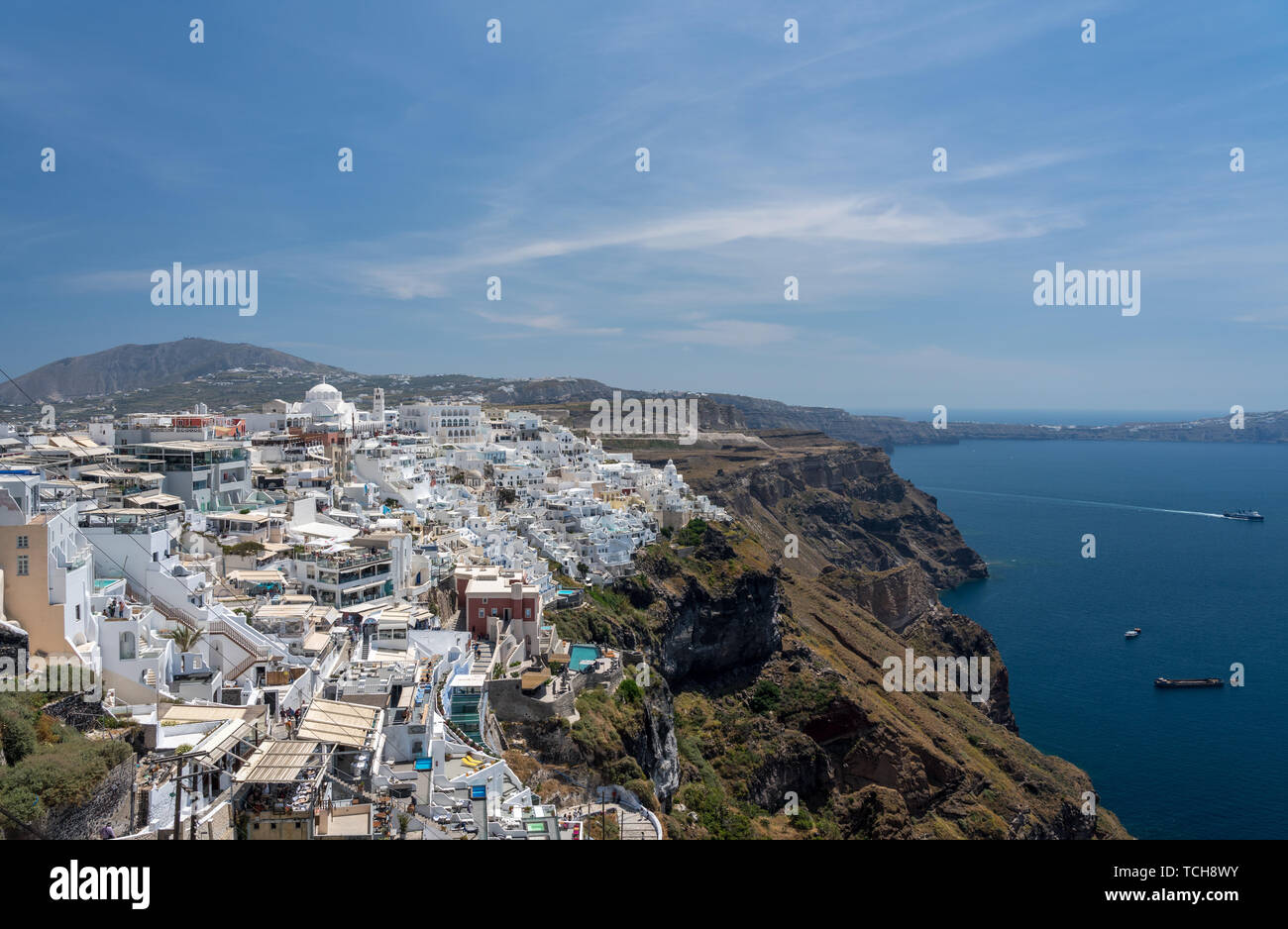 Crowded cave houses on cliff in Fira Santorini Stock Photo - Alamy