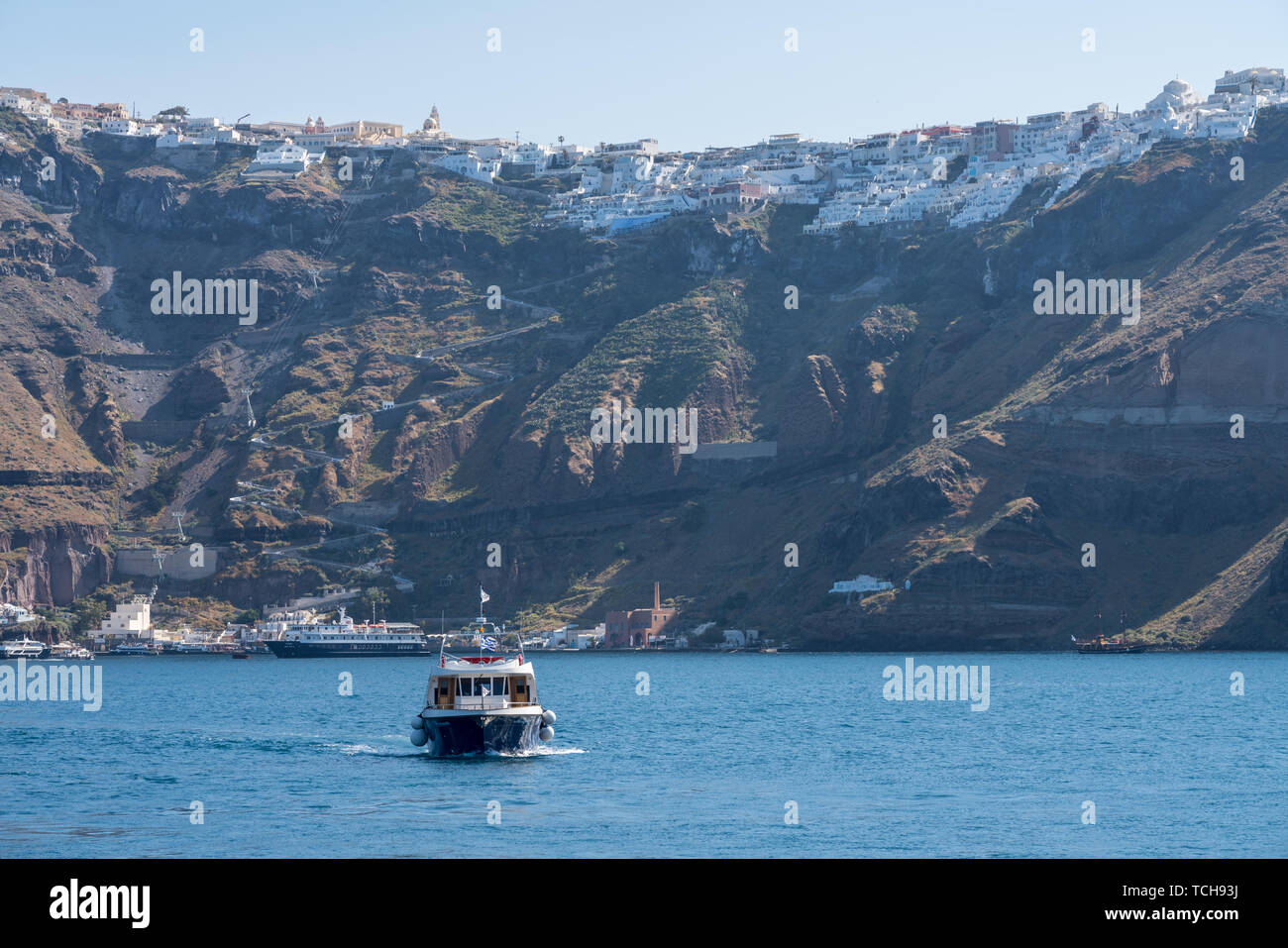 Tender boats to transport tourists into Santorini Stock Photo - Alamy