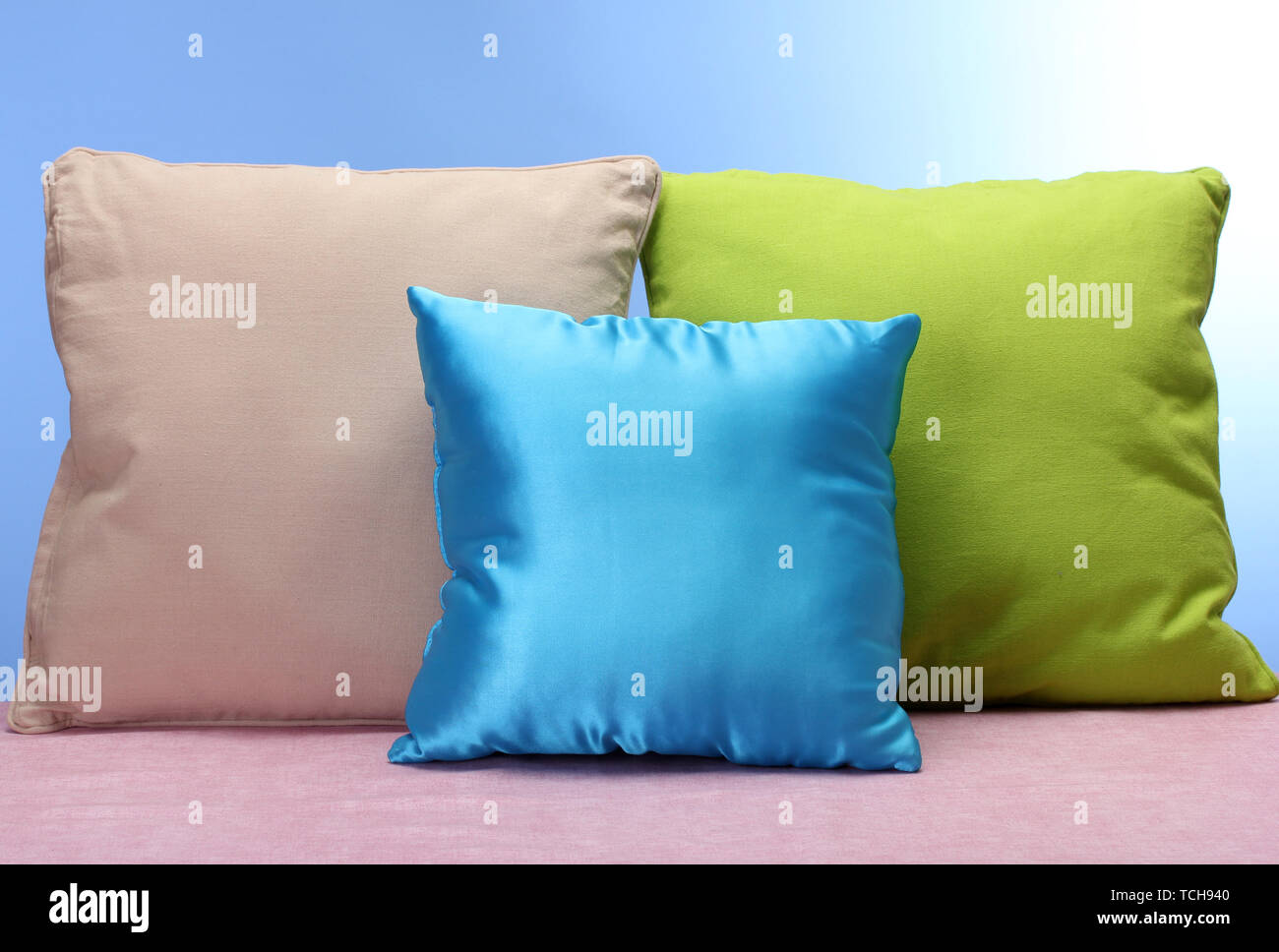 bright pillows on blue background Stock Photo - Alamy
