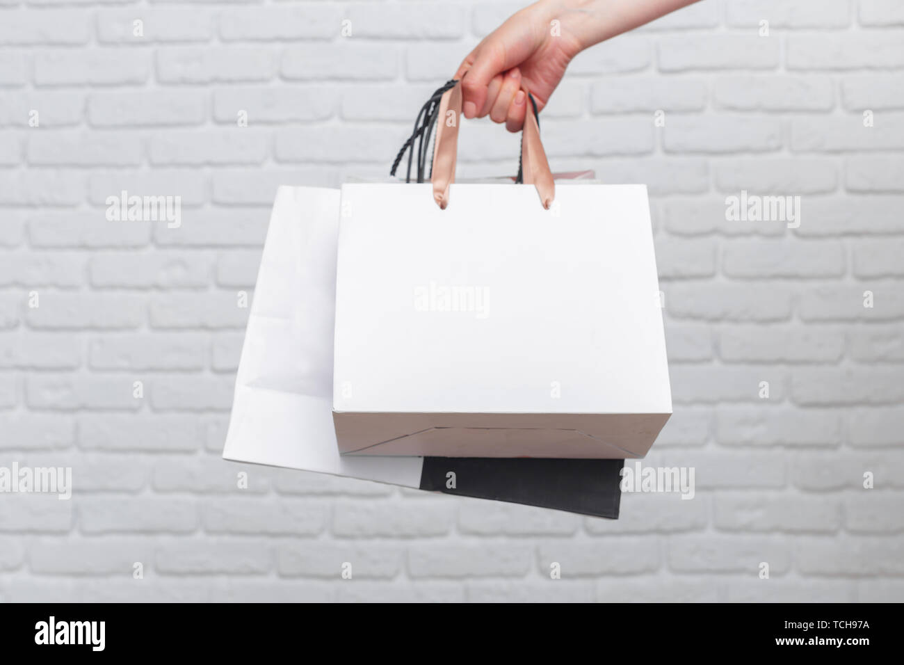 hand holding paper bag Stock Photo - Alamy