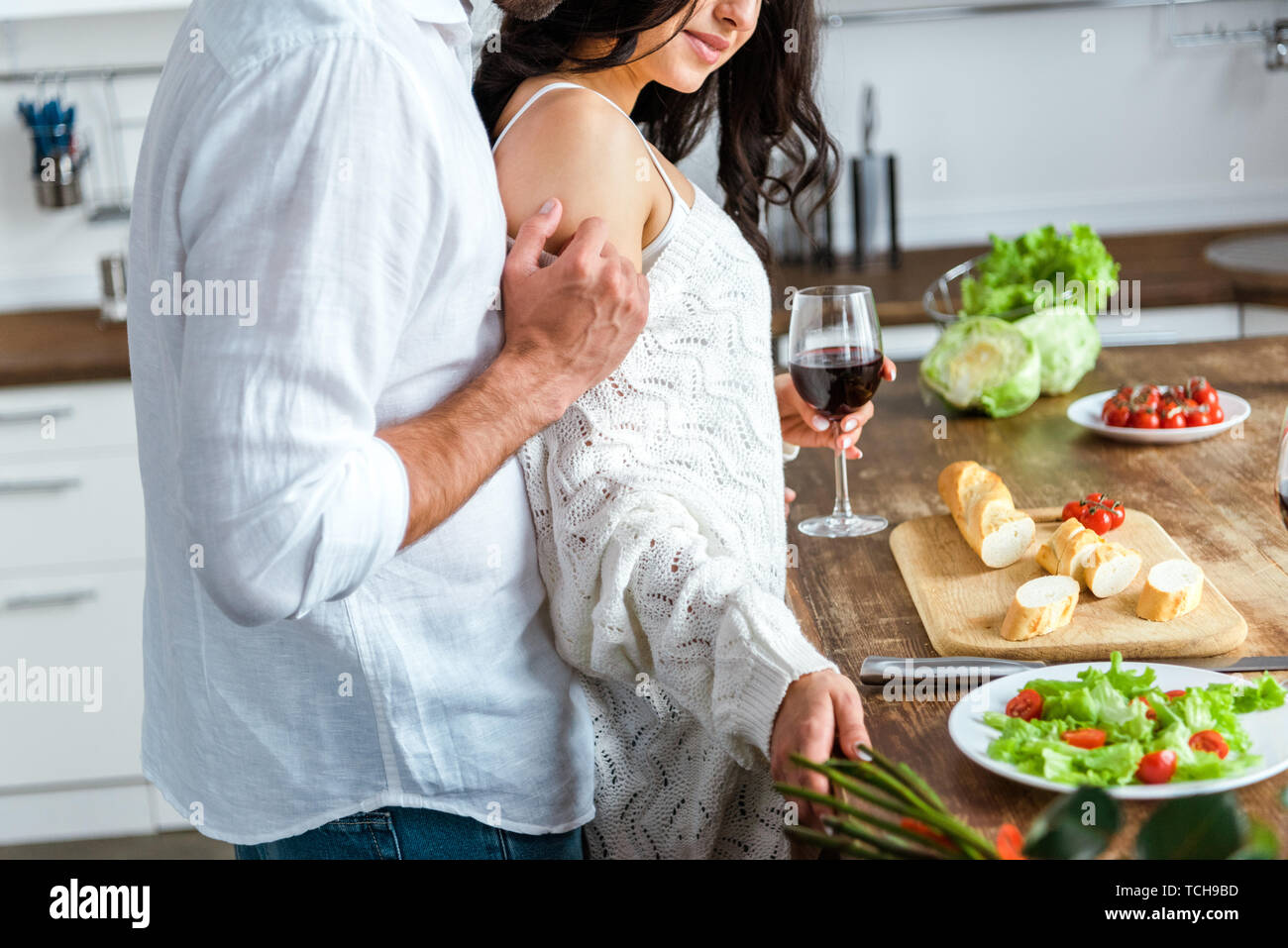 partial view of passionate man touching woman at kitchen Stock Photo ...