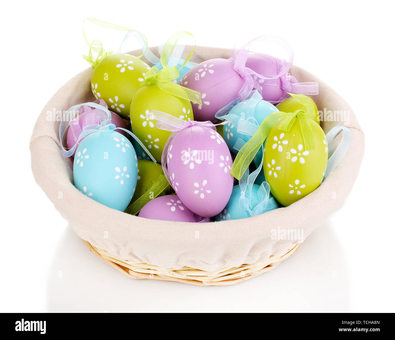 Colorful easter eggs in basket isolated on white Stock Photo - Alamy