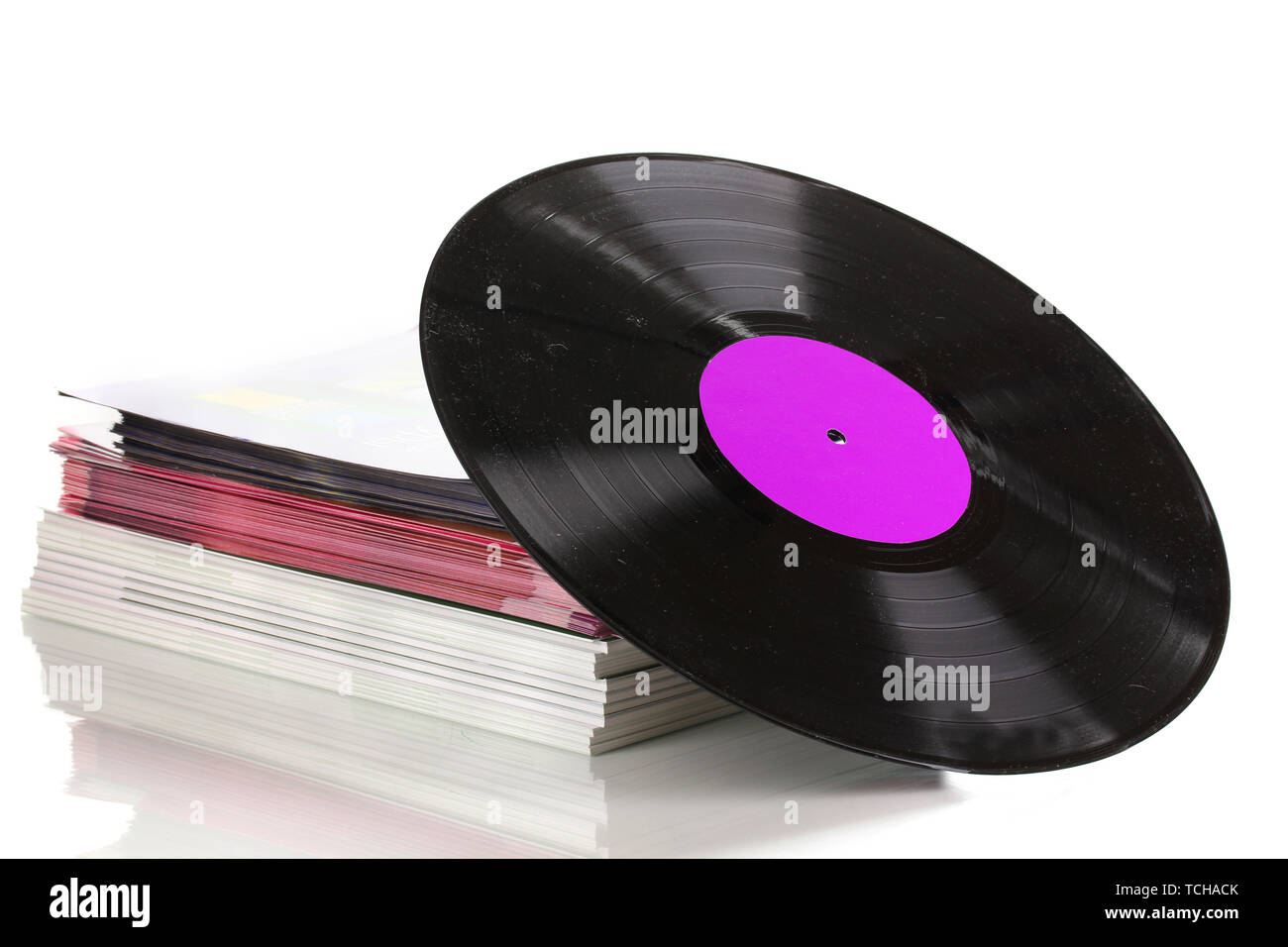 Black vinyl record and stack of magazines isolated on white Stock Photo ...