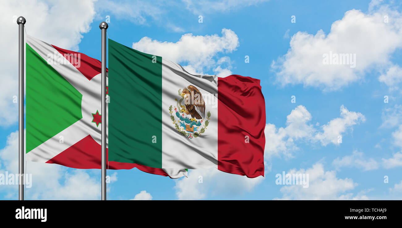 Burundi and Mexico flag waving in the wind against white cloudy blue ...