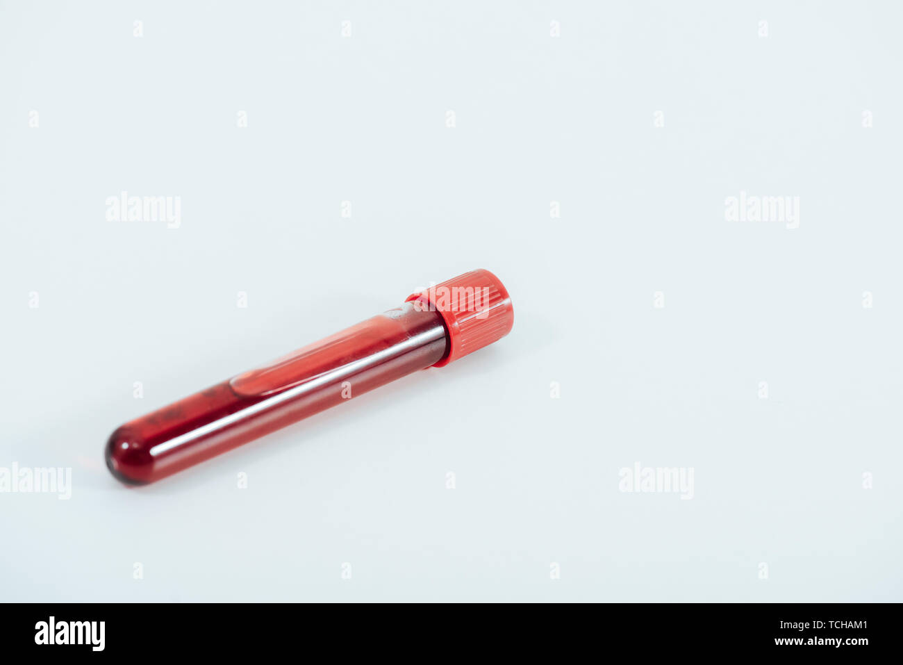 test tube with blood sample on white surface Stock Photo - Alamy