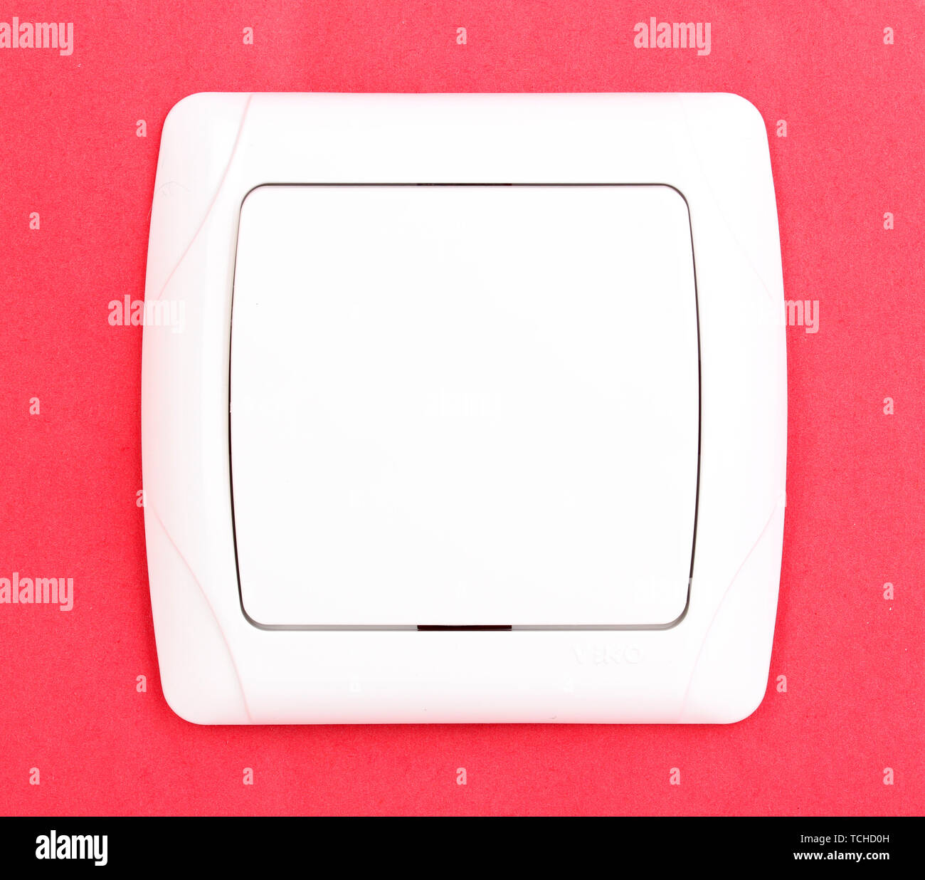 Modern light switch on red background Stock Photo - Alamy