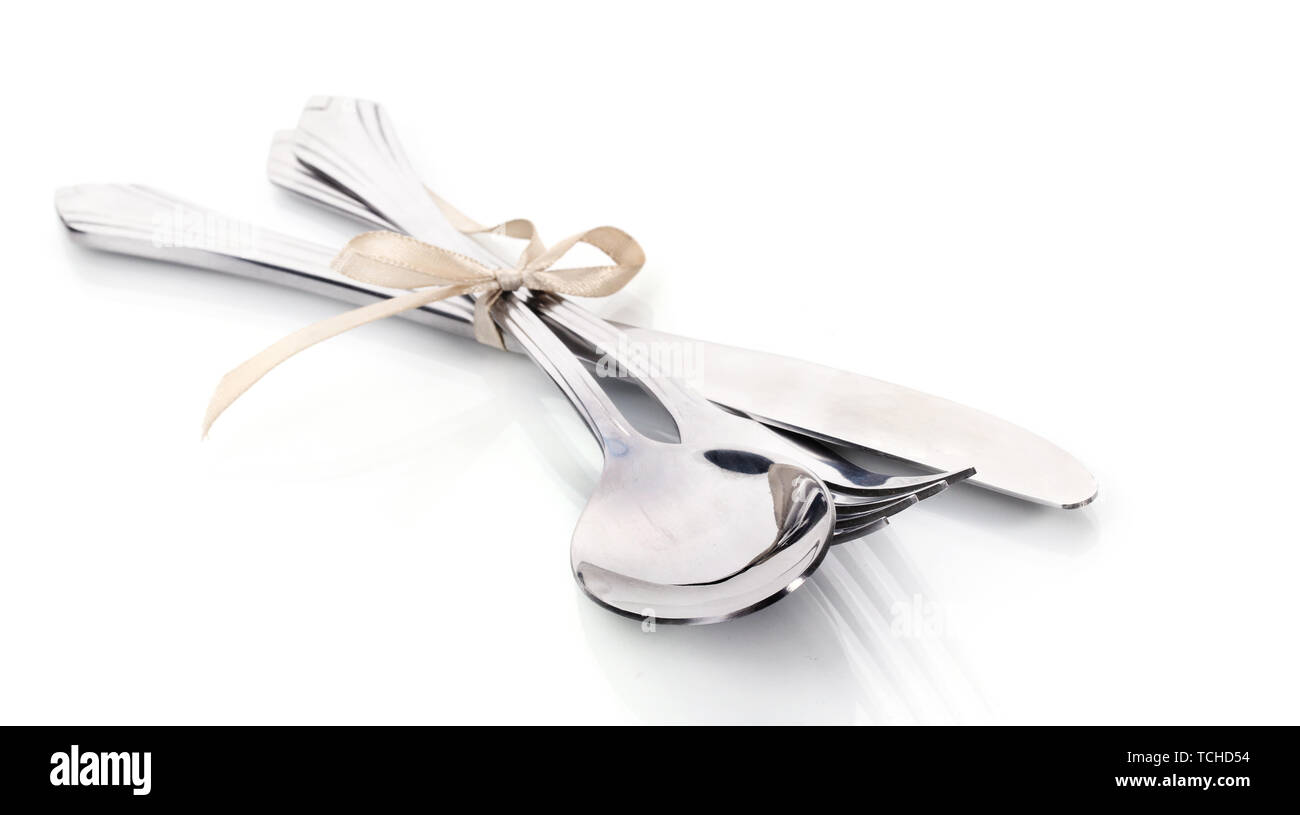 Silver fork, spoon and knife tied with ribbon isolated on white Stock ...