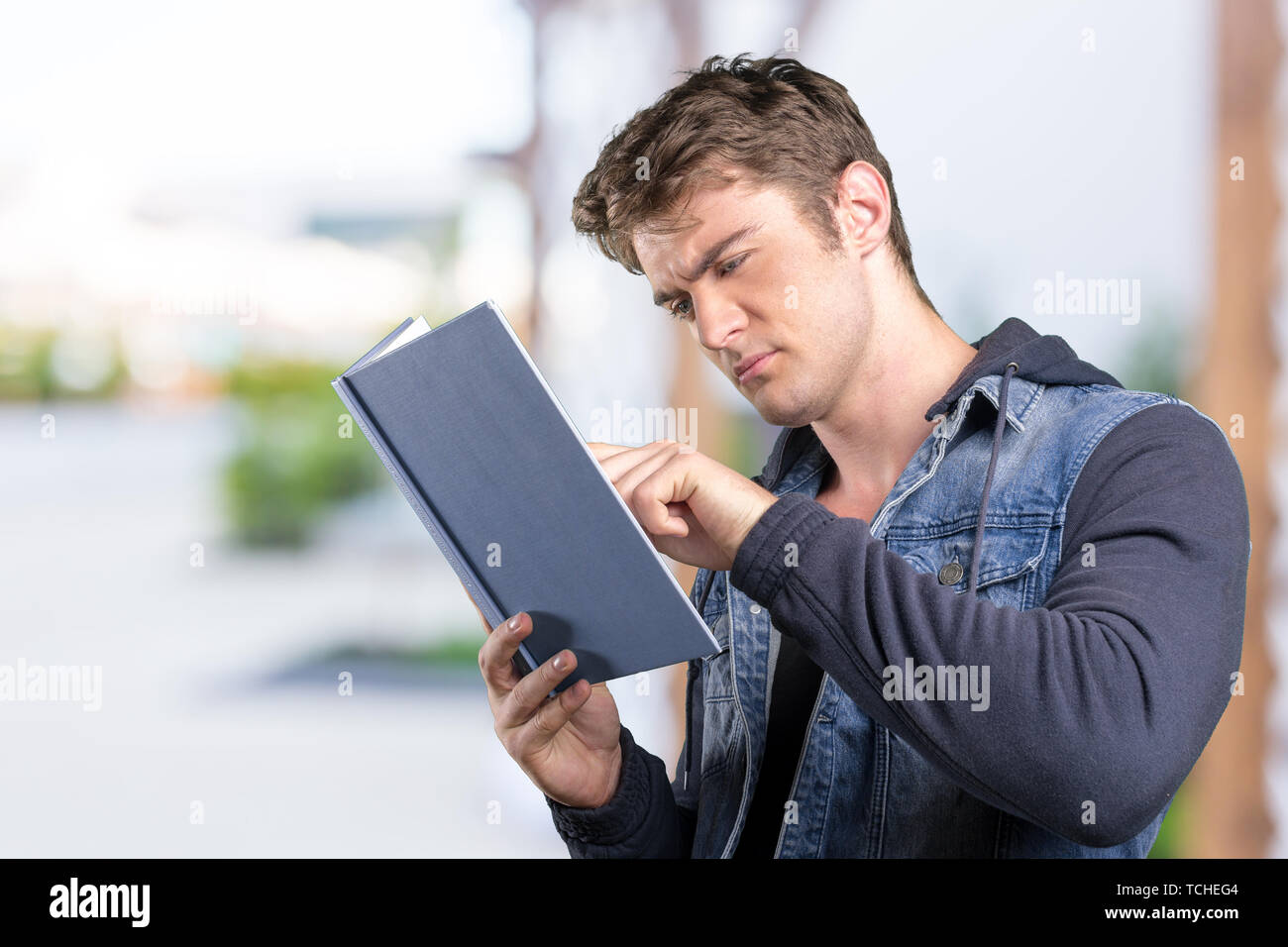 adult man reading book Stock Photo - Alamy