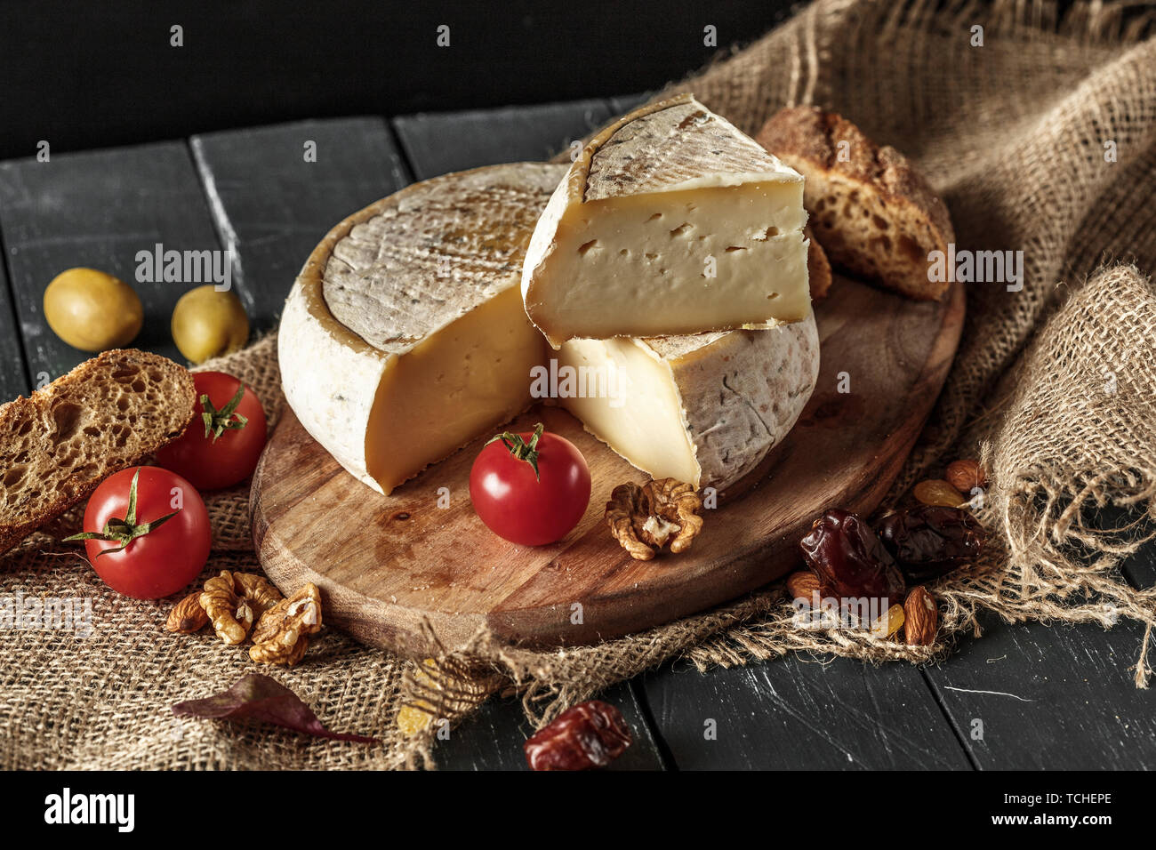 Cheese on the wooden table Stock Photo - Alamy
