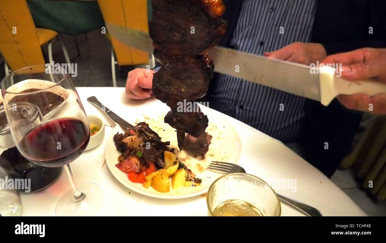 Close up of a picanha roast beef cut in Brazilian steak house ...