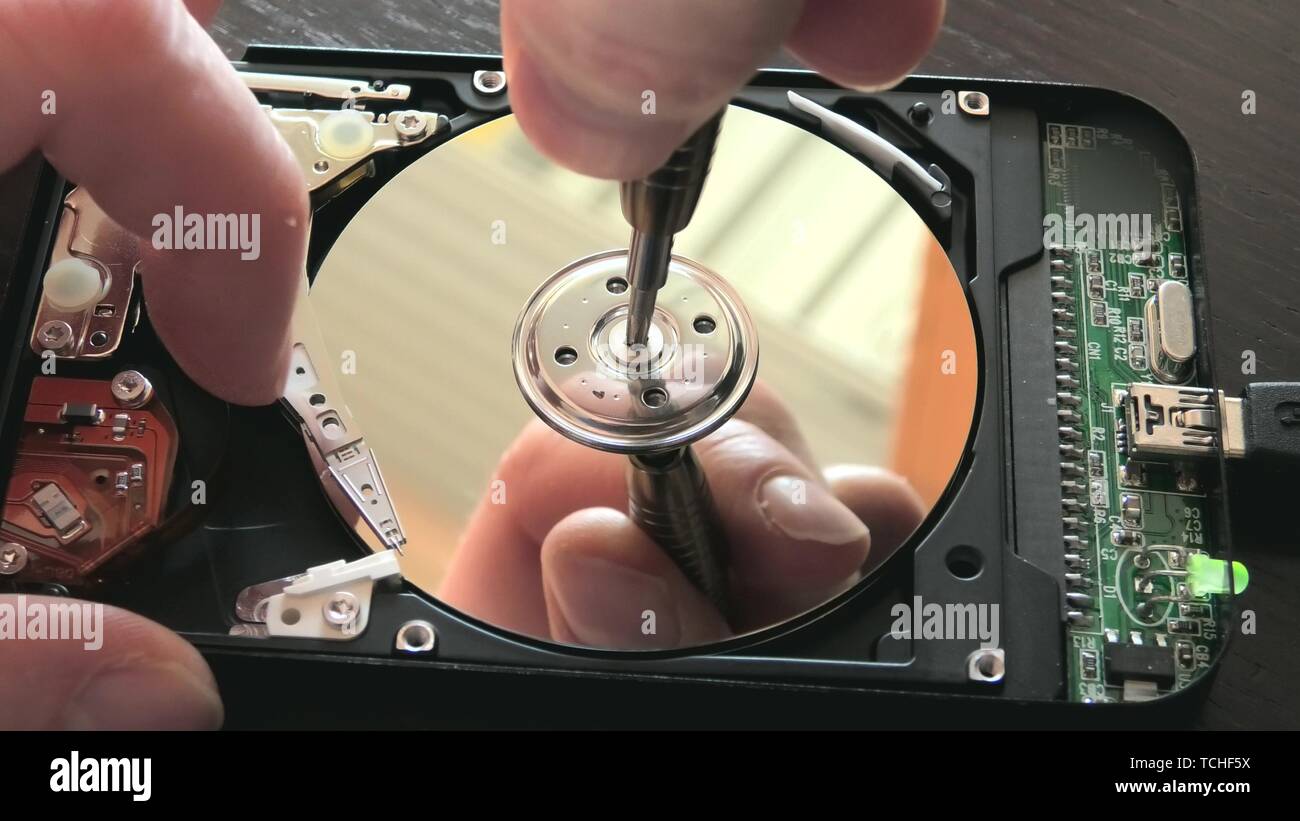 fixing an open hard drive broken with stuck head Stock Photo - Alamy