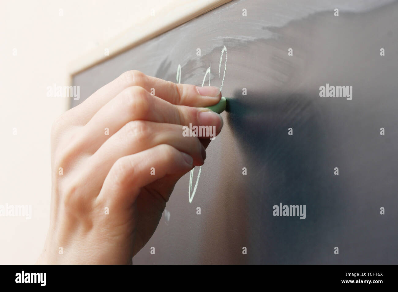 Hand writing on blackboard Stock Photo - Alamy