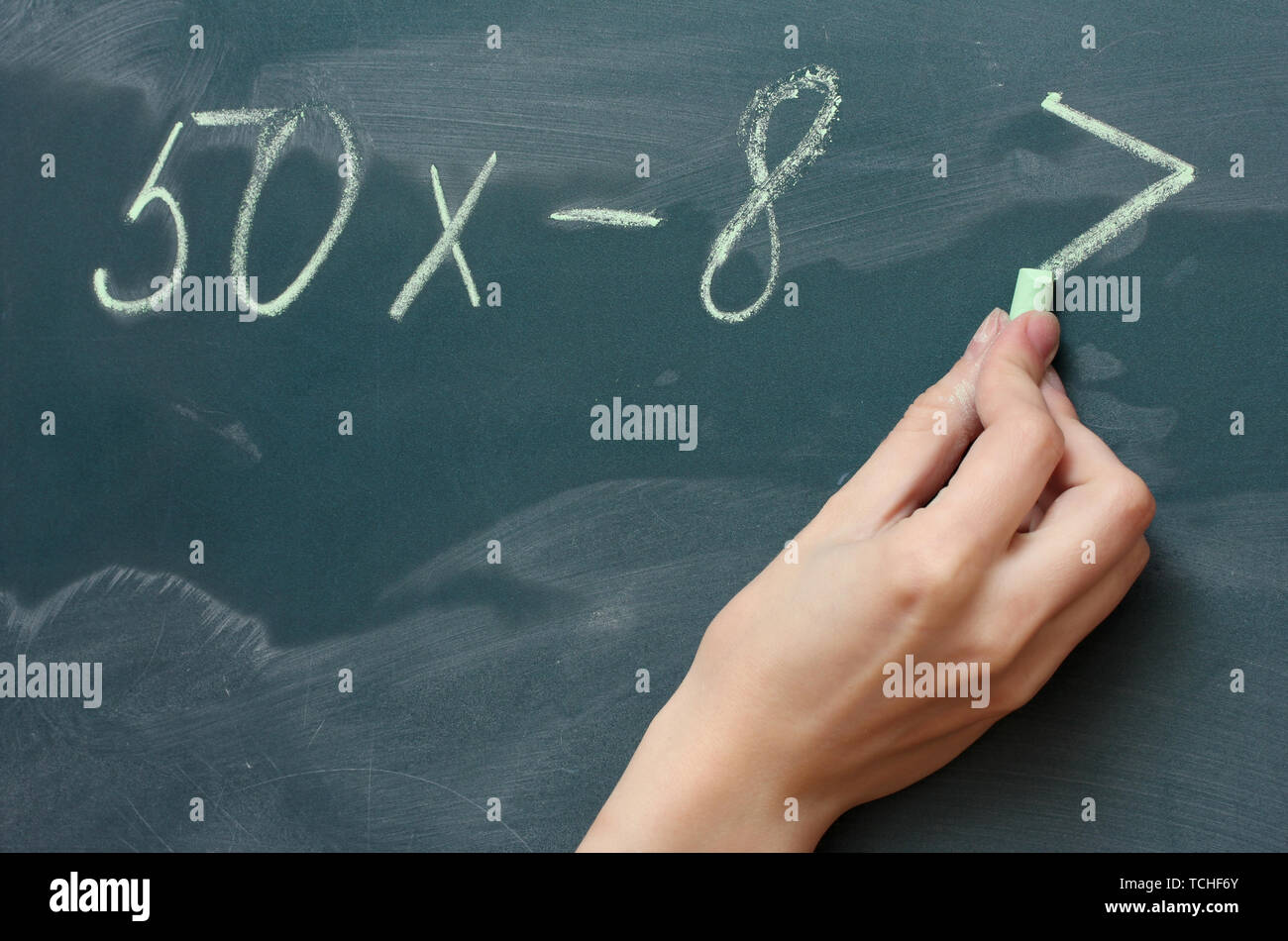 Hand writing mathematical test on the blackboard Stock Photo - Alamy