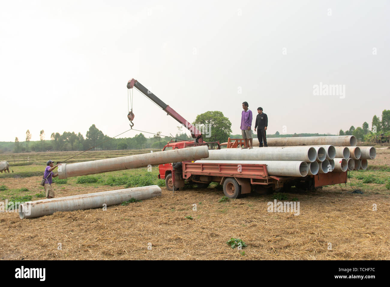 Nakhon Phanom, Thailand. March 4, 2019 : Concrete pipes loading with ...