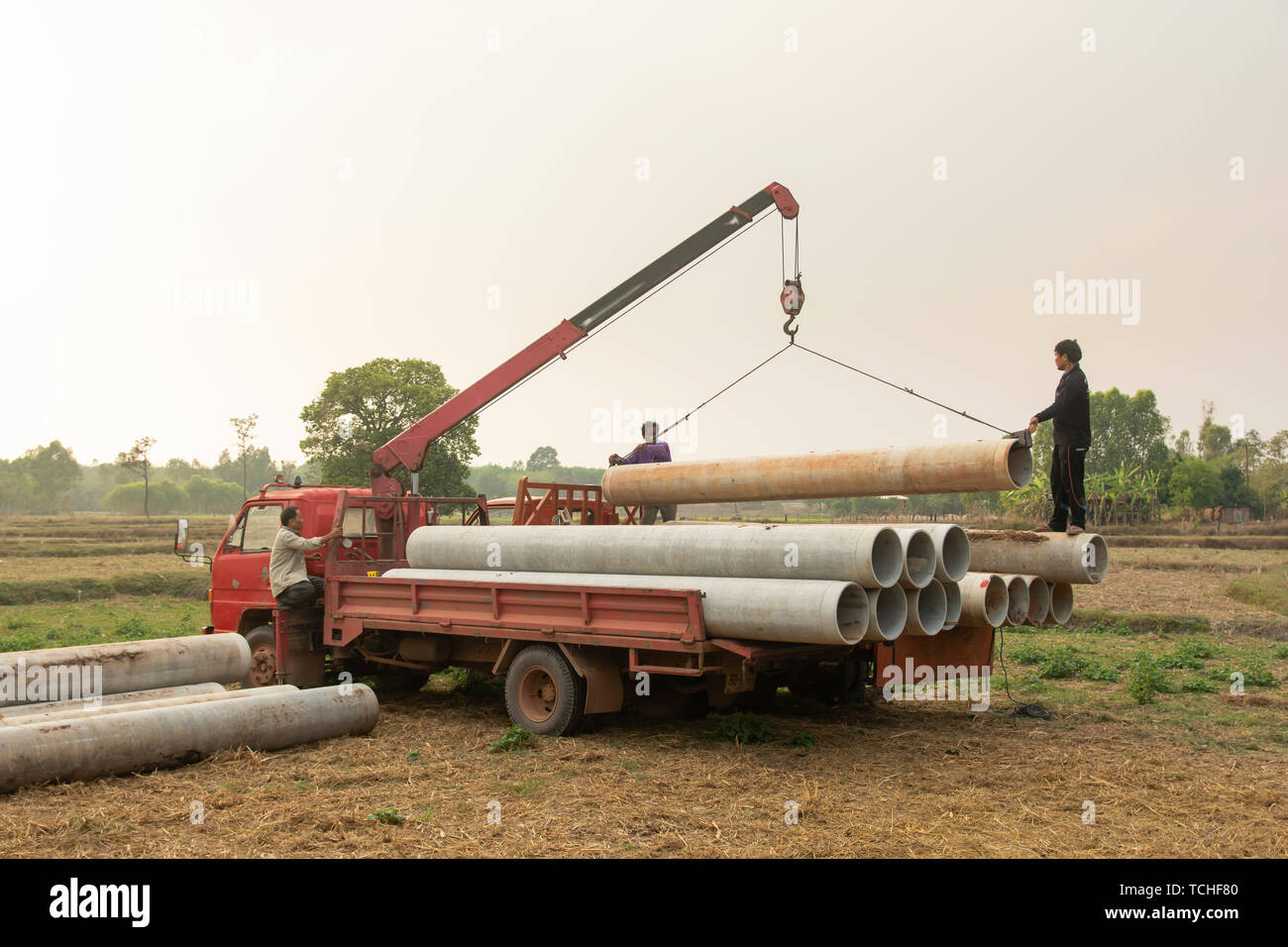 Nakhon Phanom, Thailand. March 4, 2019 : Concrete pipes loading with ...
